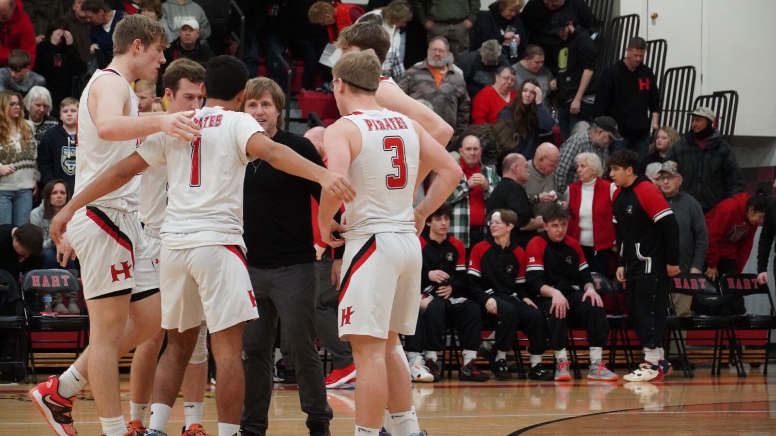 Hart’s boys basketball team joins title party, celebrates first league ...